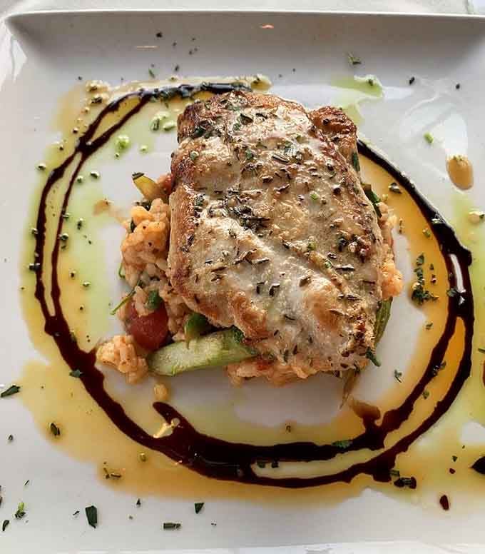 Pan-seared chicken elevated to an art form, because even familiar favorites deserve the star treatment here.