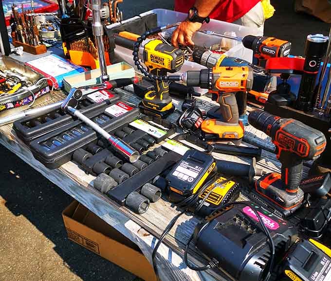 Every handyman's dream spread: power drills and socket sets arranged like a hardware store went yard sale.