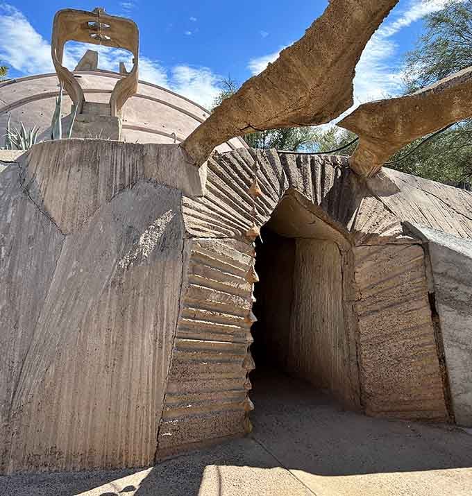 That entrance looks like it grew from the earth itself, inviting you into architectural wonderland territory.