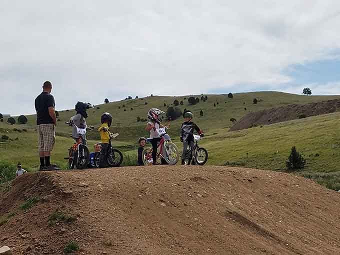 Young riders tackle the dirt track while parents wonder if their own knees could still handle this kind of adventure.