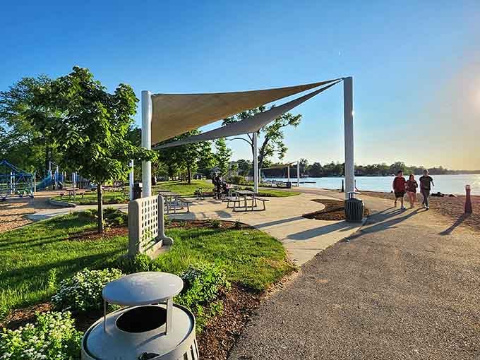 Modern shade structures frame golden-hour views, turning simple picnic spots into Instagram-worthy lakeside dining experiences worth sharing.