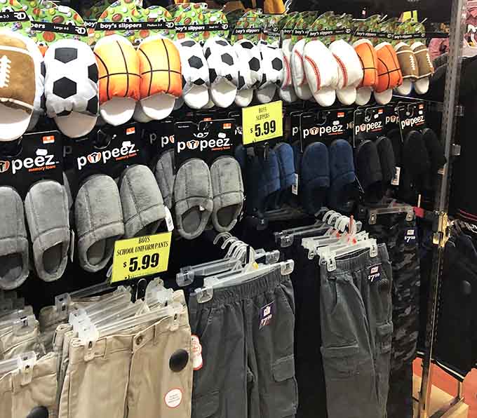 Sports-themed slippers that would make any couch quarterback proud, all lined up like they're ready for game day.