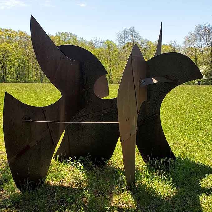 The interplay of light and shadow on this sturdy steel piece creates a fascinating focal point in this peaceful setting.