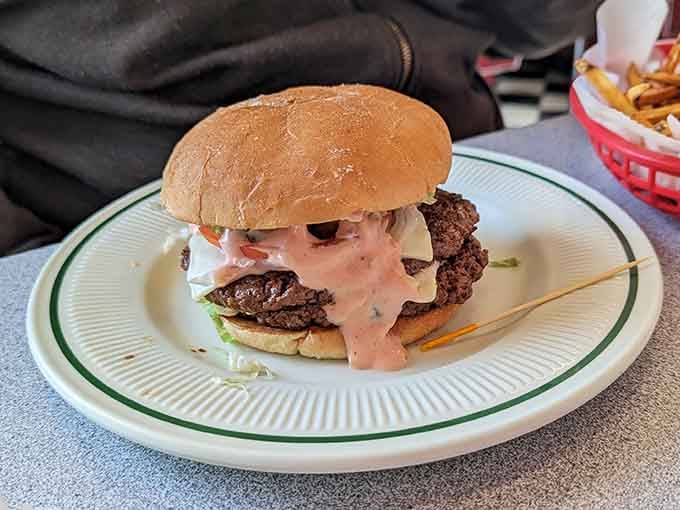 Two patties stacked high with all the fixings&mdash;because sometimes one patty just won't cut it, friend.