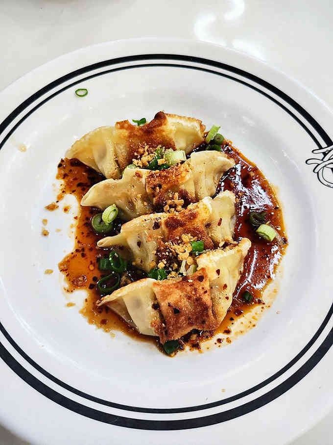 These dumplings are so perfectly pan-fried, they deserve their own comic book origin story and fan club.