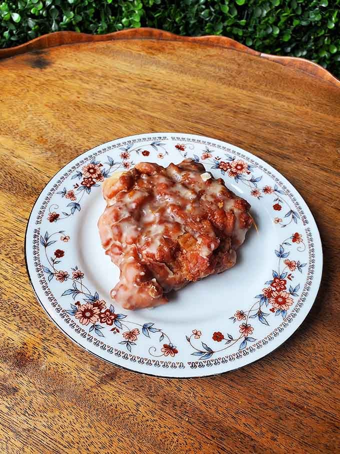 That apple fritter with its glaze dripping down is basically autumn in pastry form, and we're here for it.