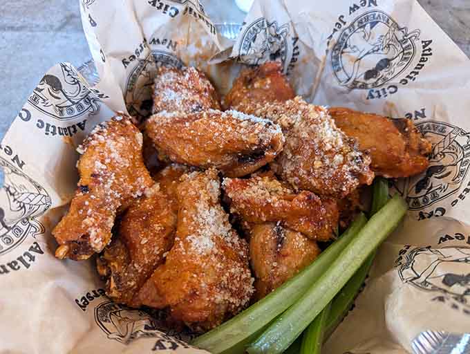 Wings dusted with what appears to be parmesan create the kind of finger-licking situation that requires extra napkins and zero regrets about your life choices.