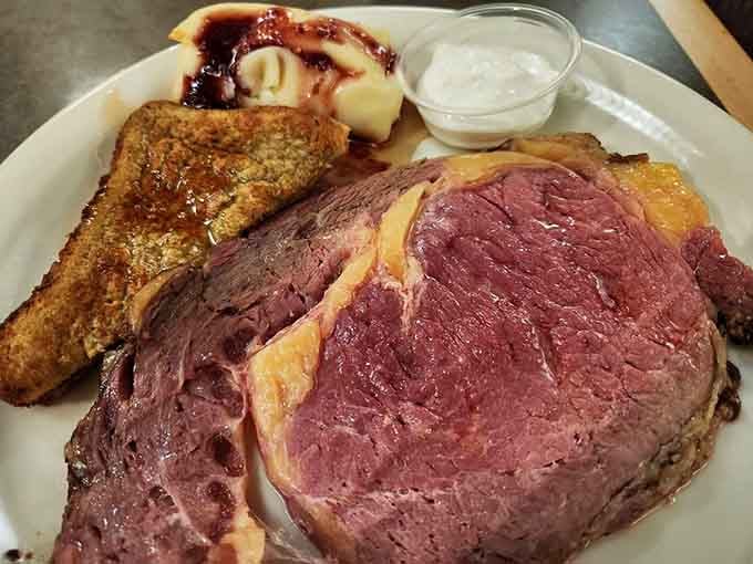 Prime rib carved this perfectly pink belongs in a museum, or more practically, on your plate immediately.