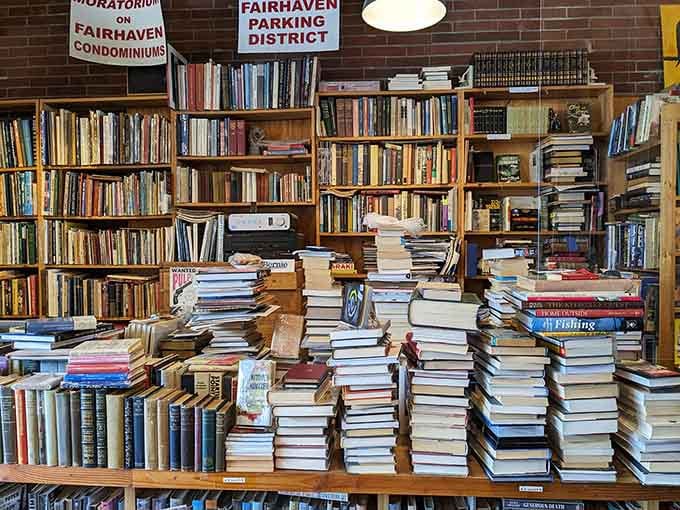 These towering book stacks are what happens when Marie Kondo loses the battle against pure literary joy.