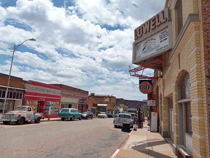 Vintage storefronts line up like a Technicolor dream where every building tells stories your parents might actually remember firsthand.