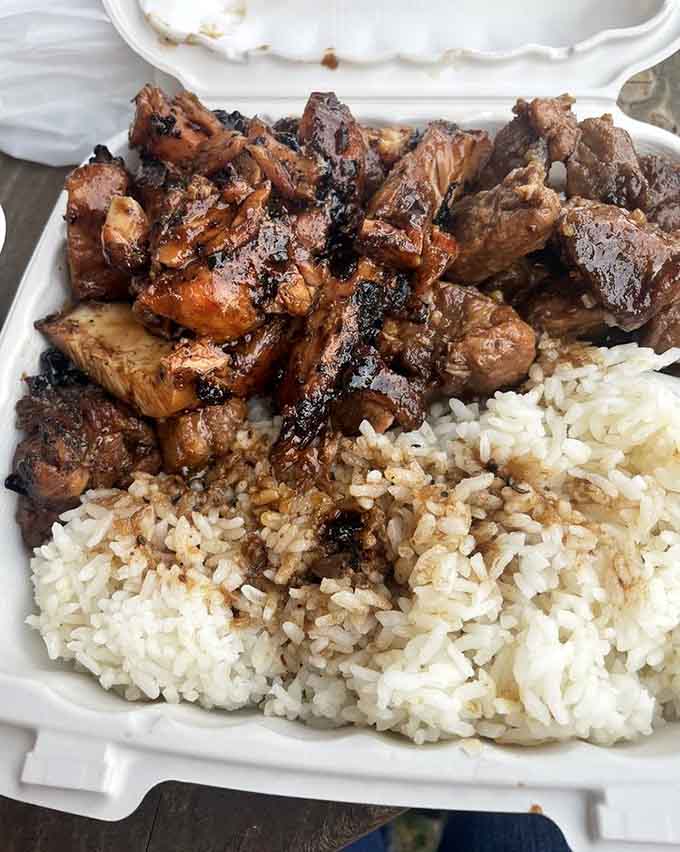 Tender barbecued chicken and pork adobo over rice, the kind of plate that makes everything right.