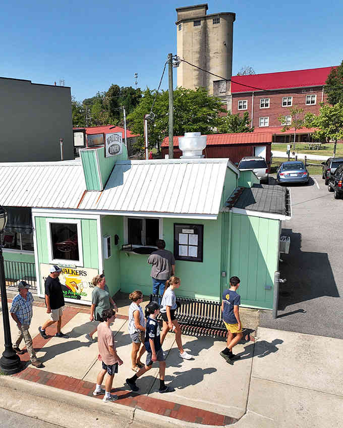 Nothing says small-town America quite like folks lining up at a charming green building for something delicious.