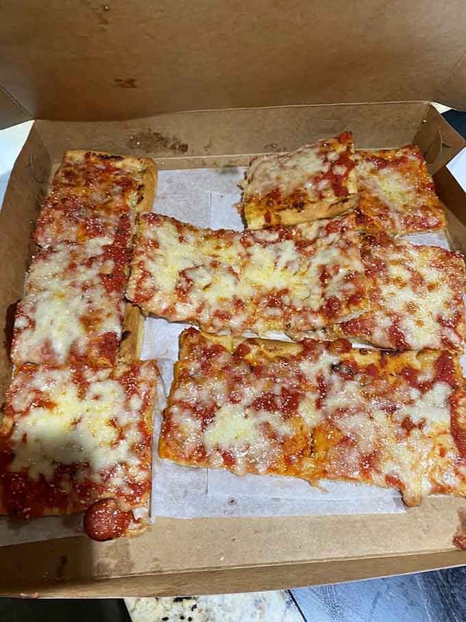 Golden cheese bubbling to crispy perfection, this is what pizza dreams are made of, plain and simple.