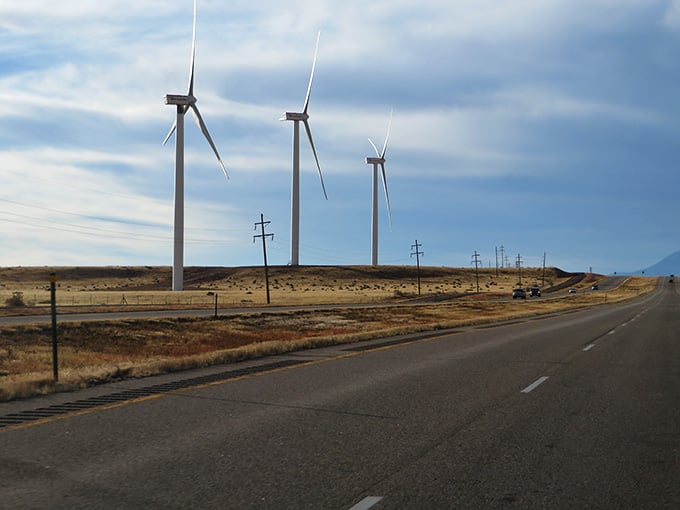 Modern wind turbines meet ancient landscapes, proving Colorado's always been about harnessing natural power.