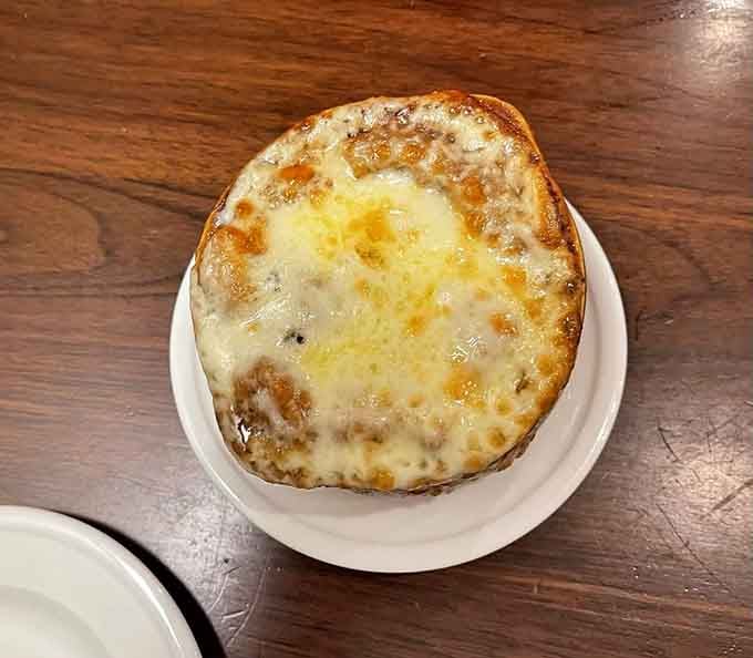 French onion soup with a cheese blanket so thick it could double as insulation for your winter home.