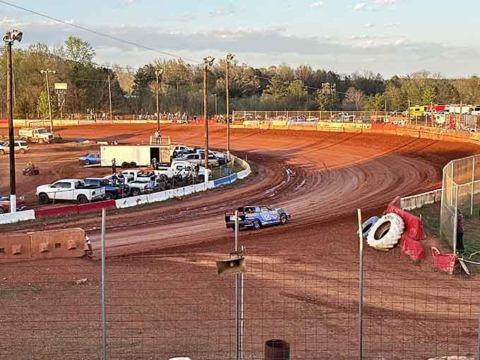 Red clay flies as stock cars roar around the oval, delivering Saturday night thrills under those brilliant stadium lights.