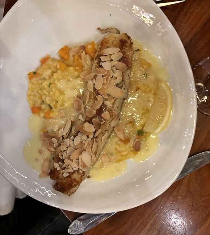 Crab-stuffed walleye topped with toasted almonds proves that sometimes more really is more when it comes to seafood perfection.