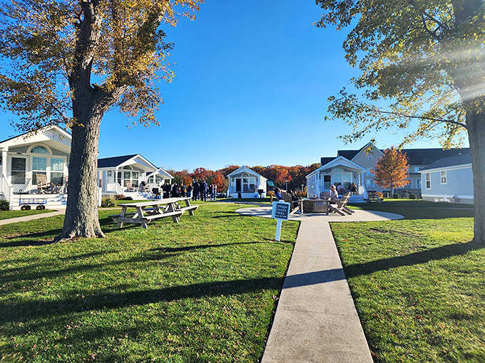 Charming cottages arranged like a Norman Rockwell painting create an idyllic autumn retreat by the water.