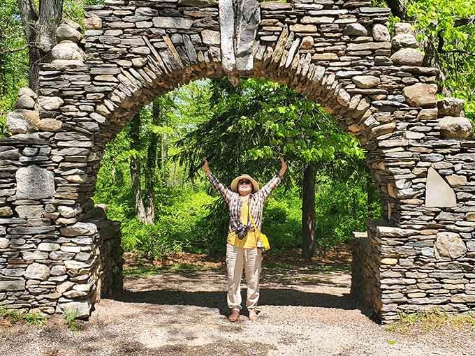 Stone archways frame woodland paths, inviting visitors to explore like they're starring in their own adventure film.