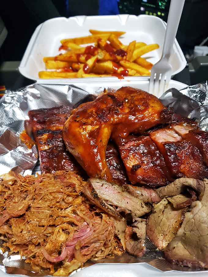 The Big Daddy Sampler doesn't apologize for its ambition: ribs, brisket, chicken, and pulled pork in glorious harmony.