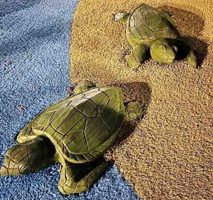 These turtle sculptures add whimsical charm to the sandy areas, perfect for photo ops and pretend marine biology lessons.