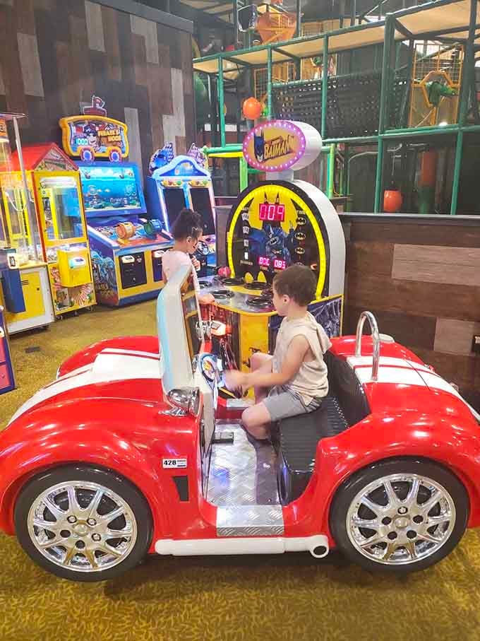 That cherry-red sports car arcade game is basically every kid's fantasy vehicle without the insurance premiums.