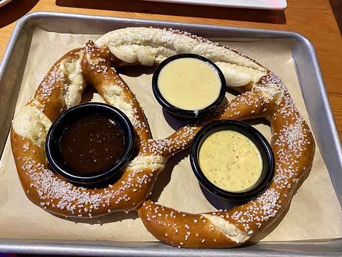 Soft pretzels dusted with salt and served with three dipping sauces because one sauce is never enough for perfection.