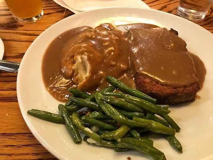 Meatloaf smothered in gravy proves comfort food never goes out of style, no matter the decade.