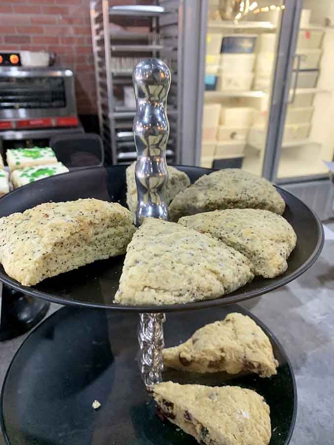 Scones displayed on tiered silver stands, bringing afternoon tea elegance to a bakery that rocks harder than most.