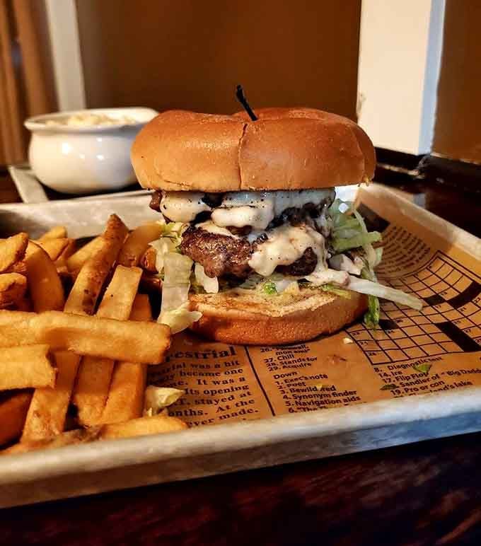This towering burger with melted cheese cascading down its sides makes a compelling case for guilty pleasures done right.