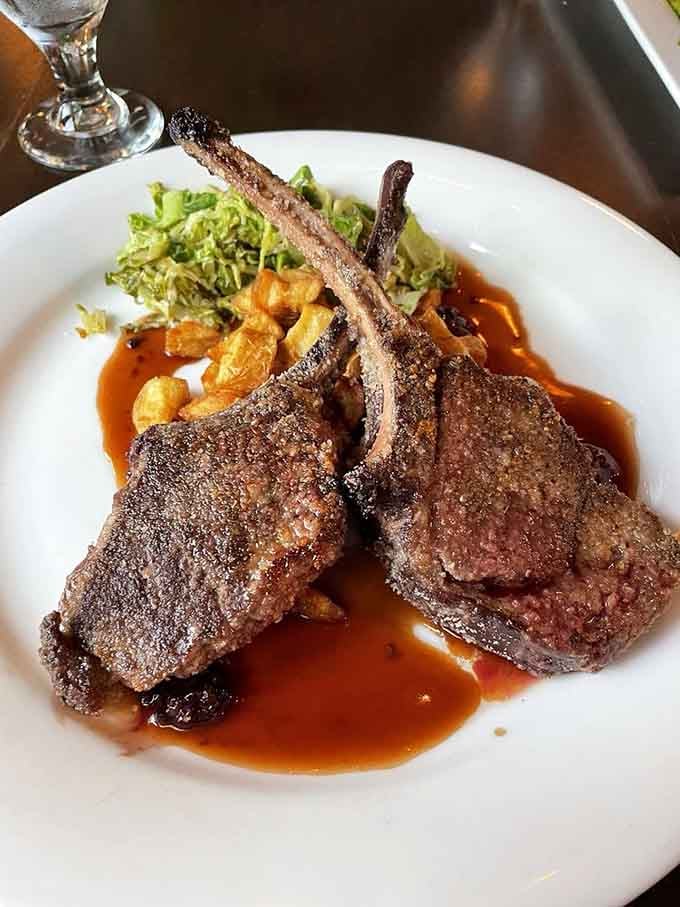 Perfectly seared lamb chops that would make any carnivore weak in the knees, plated like edible artwork on your table.