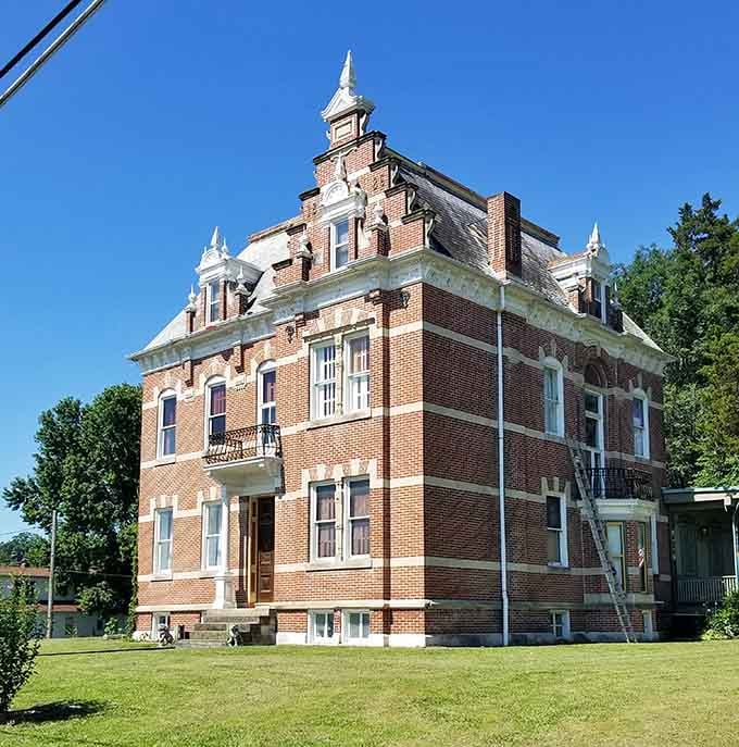 The Herzog Mansion stands proud on the hillside, reminding everyone that Victorian elegance never goes out of style.