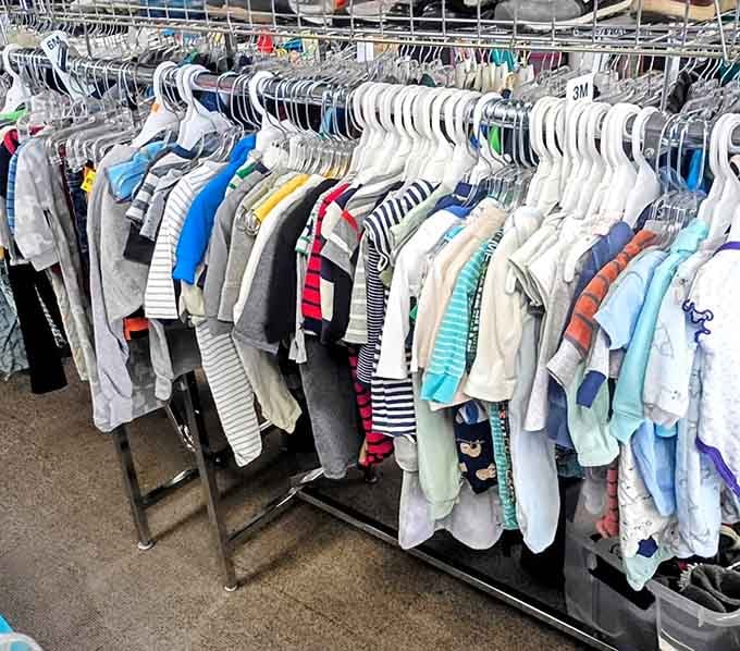 Children's clothing racks bursting with colors like a rainbow decided to open a boutique.