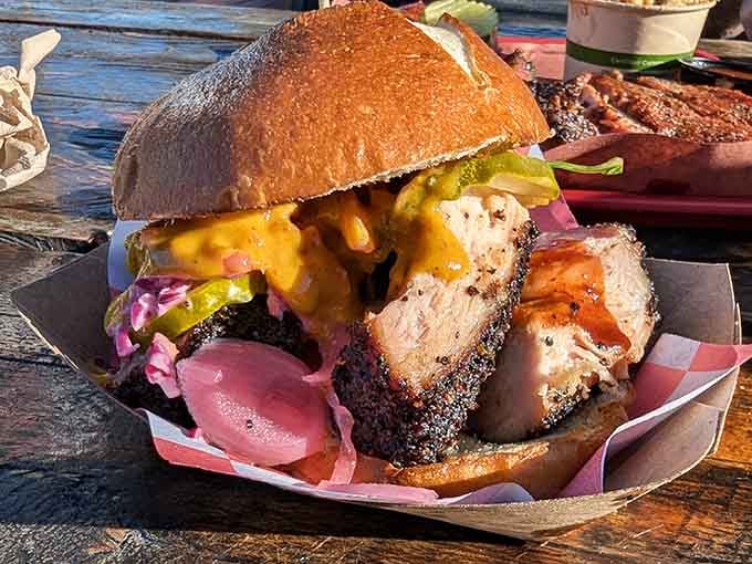 This sandwich is what happens when BBQ masters decide to get creative with perfectly smoked meat and toppings.