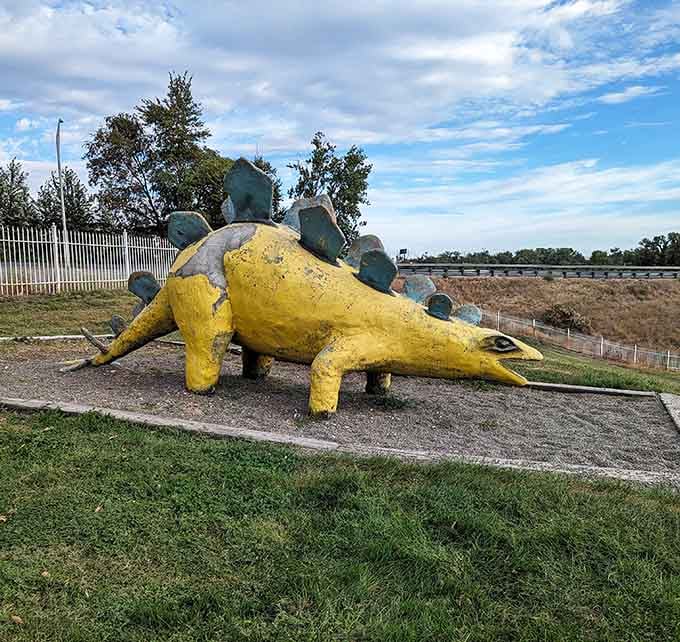 Sporting a sunny yellow coat, this Stegosaurus proves dinosaurs can absolutely pull off bold fashion choices with confidence.