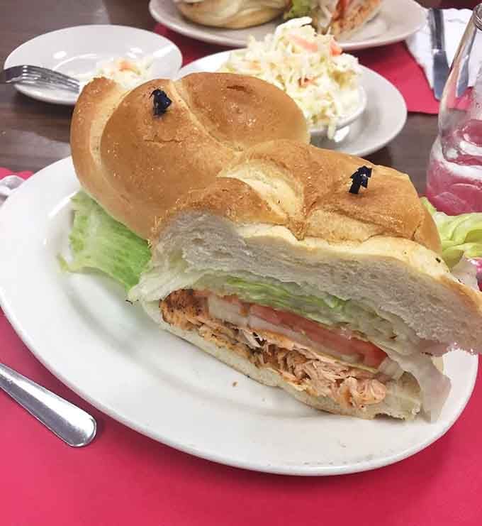 That salmon sandwich on a fresh roll looks like it swam straight from the ocean to perfection.
