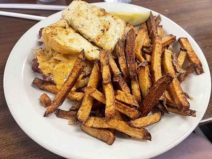 A Reuben sandwich with fries that could make you reconsider your usual lunch order forever.