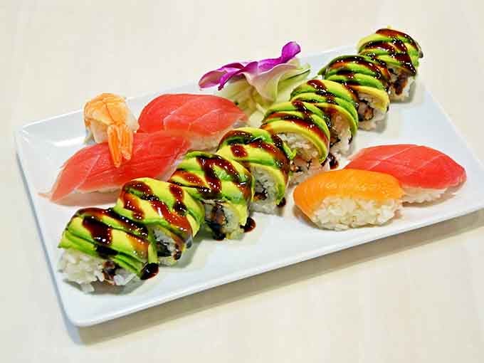That avocado drizzle situation is giving Michelangelo vibes, and those nigiri pieces are practically glowing with freshness.