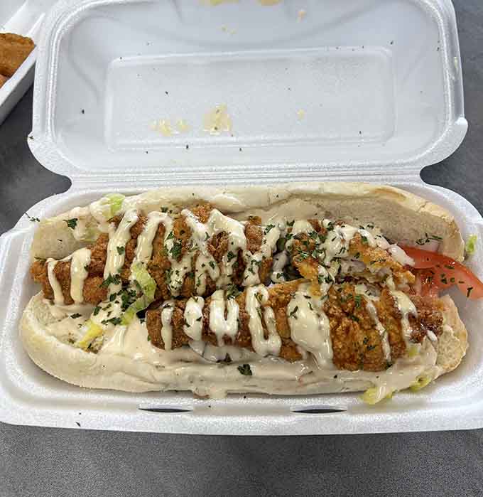 Golden catfish nestled in a foot-long roll with all the fixings, Louisiana would be proud.