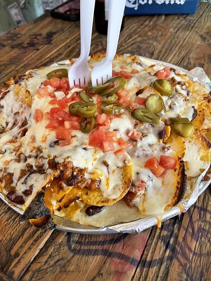 Nachos piled high with jalape&ntilde;os, because sometimes more is actually more, not less.