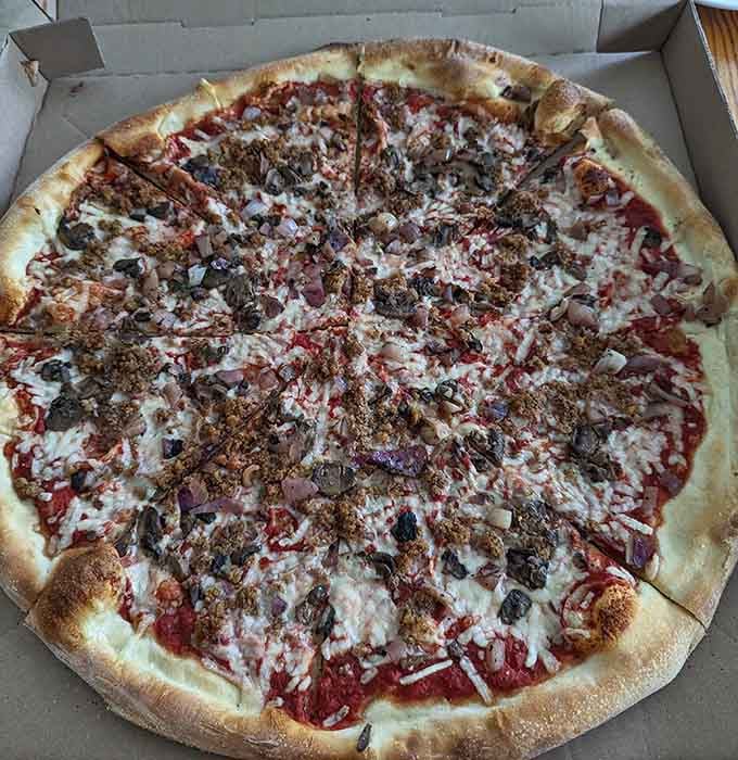 This loaded pie brings together more toppings than a Supreme Court case and twice the satisfaction.