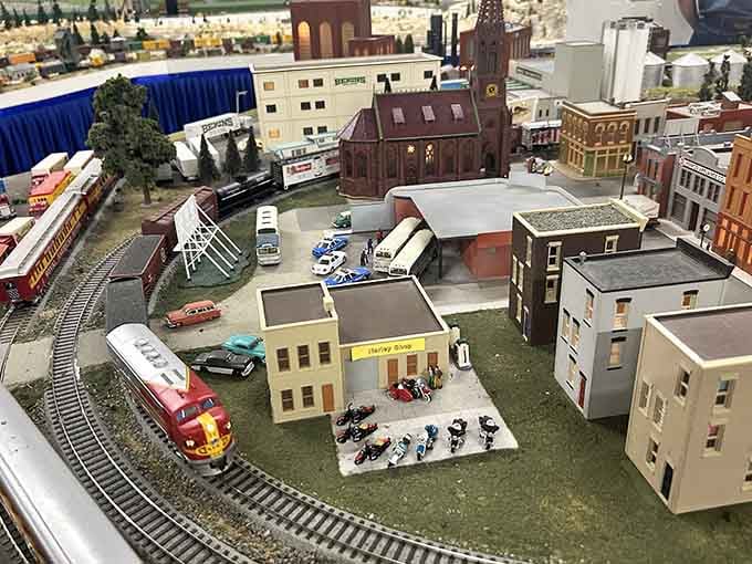 That's a real locomotive rolling through a real miniature town, and yes, it's as mesmerizing as it sounds.