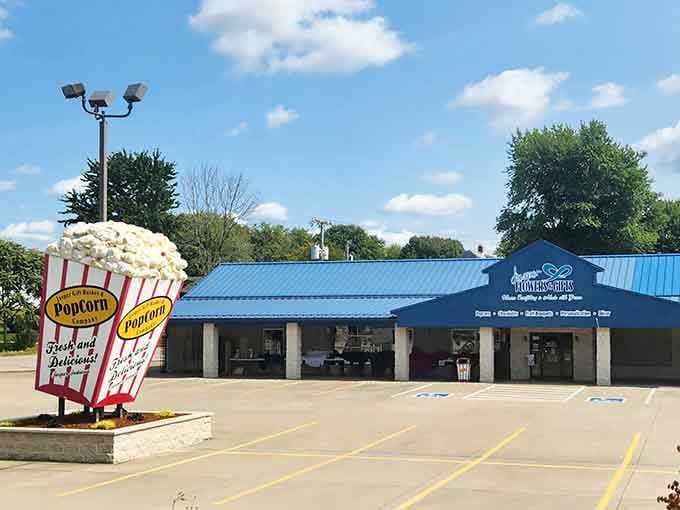 That giant popcorn bucket out front is basically screaming "fresh and delicious" louder than any billboard ever could.