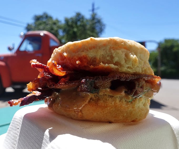 Layers of flavor stacked on an English muffin, because apparently someone decided breakfast needed to be absolutely perfect today.
