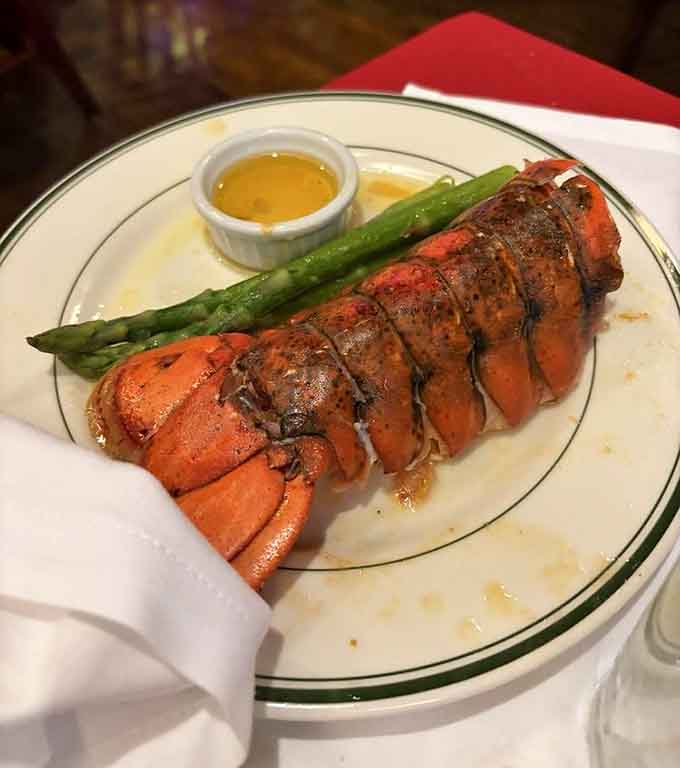 That lobster tail with asparagus and drawn butter is proof that surf and turf never goes out of style.