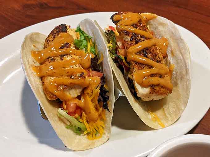 These mahi tacos bring the coast to your table with that perfect drizzle situation happening on top.
