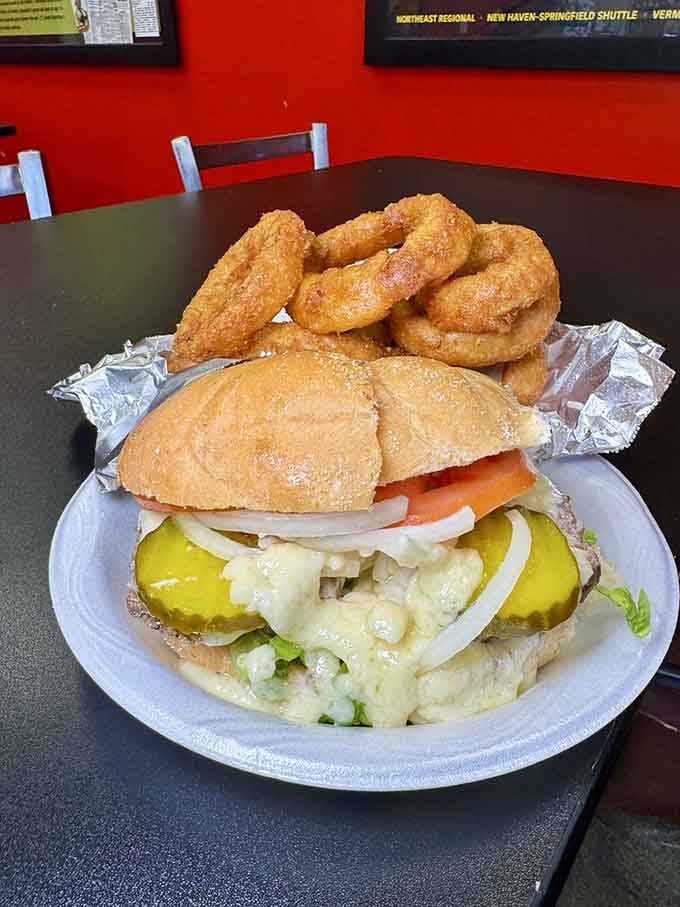 Pairing a steamed cheeseburger with golden onion rings is like Fred Astaire dancing with Ginger Rogers, pure perfection in partnership.