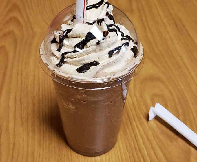 Topped with whipped cream and chocolate drizzle, this shake could make even the grumpiest villain crack a smile.