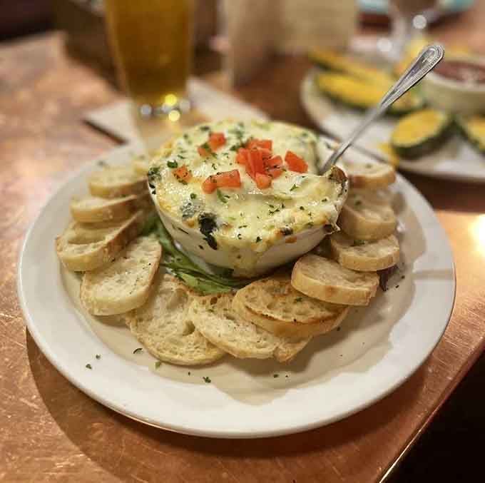 That Artichoke Spinach Dip surrounded by bread is basically a warm, creamy hug you can eat with your hands.