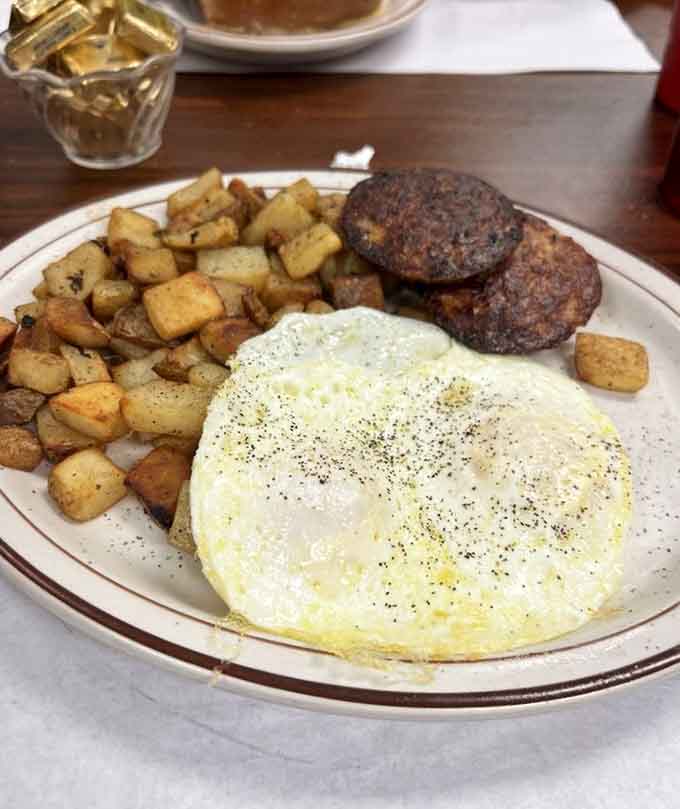 Perfectly cooked eggs, crispy hash browns, and savory sausage patties prove breakfast doesn't need to be complicated to be perfect.